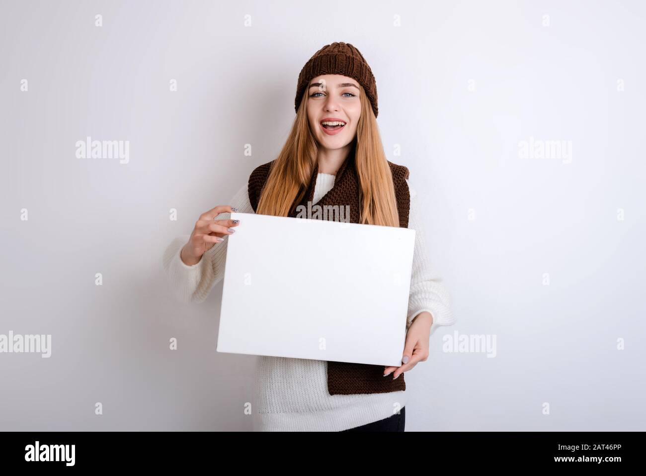 Woman holding sign in front of his face hi-res stock photography and ...