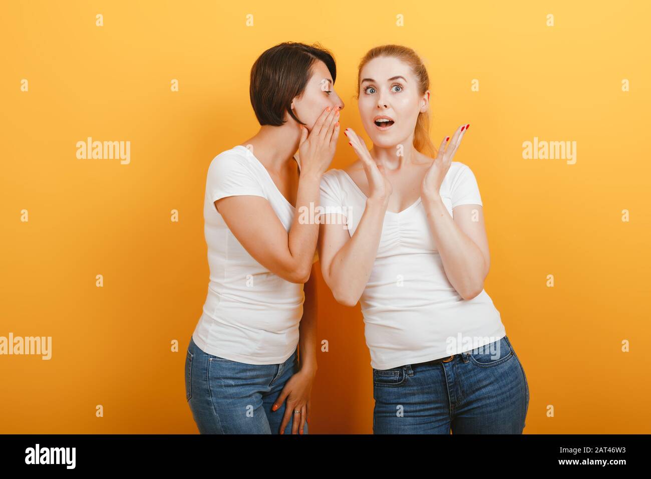 Woman say a secret to her friend. Wonder emotion on the face . - Image ...