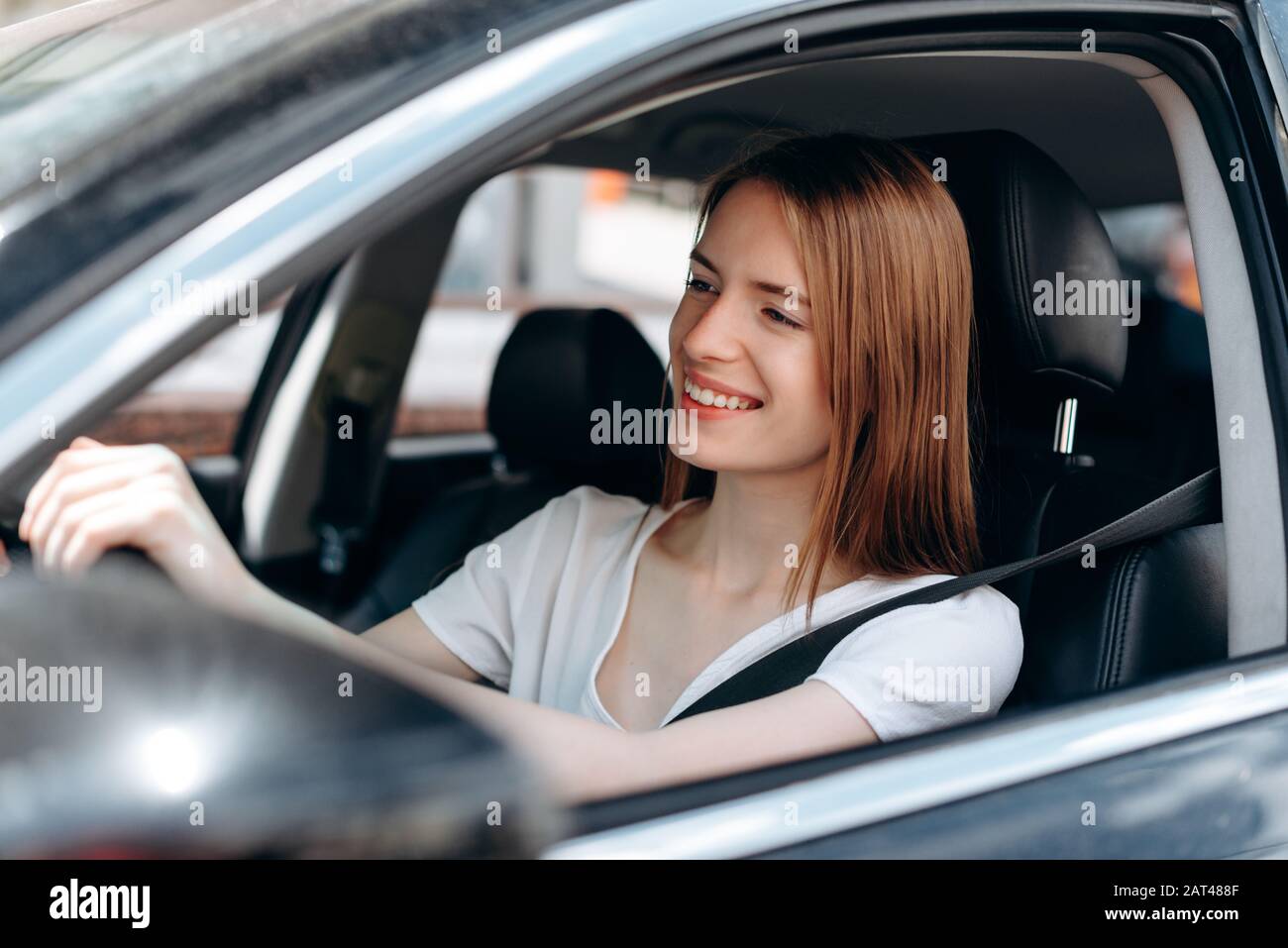 Gladness young woman drive a car and happily smiling .- Image Stock ...