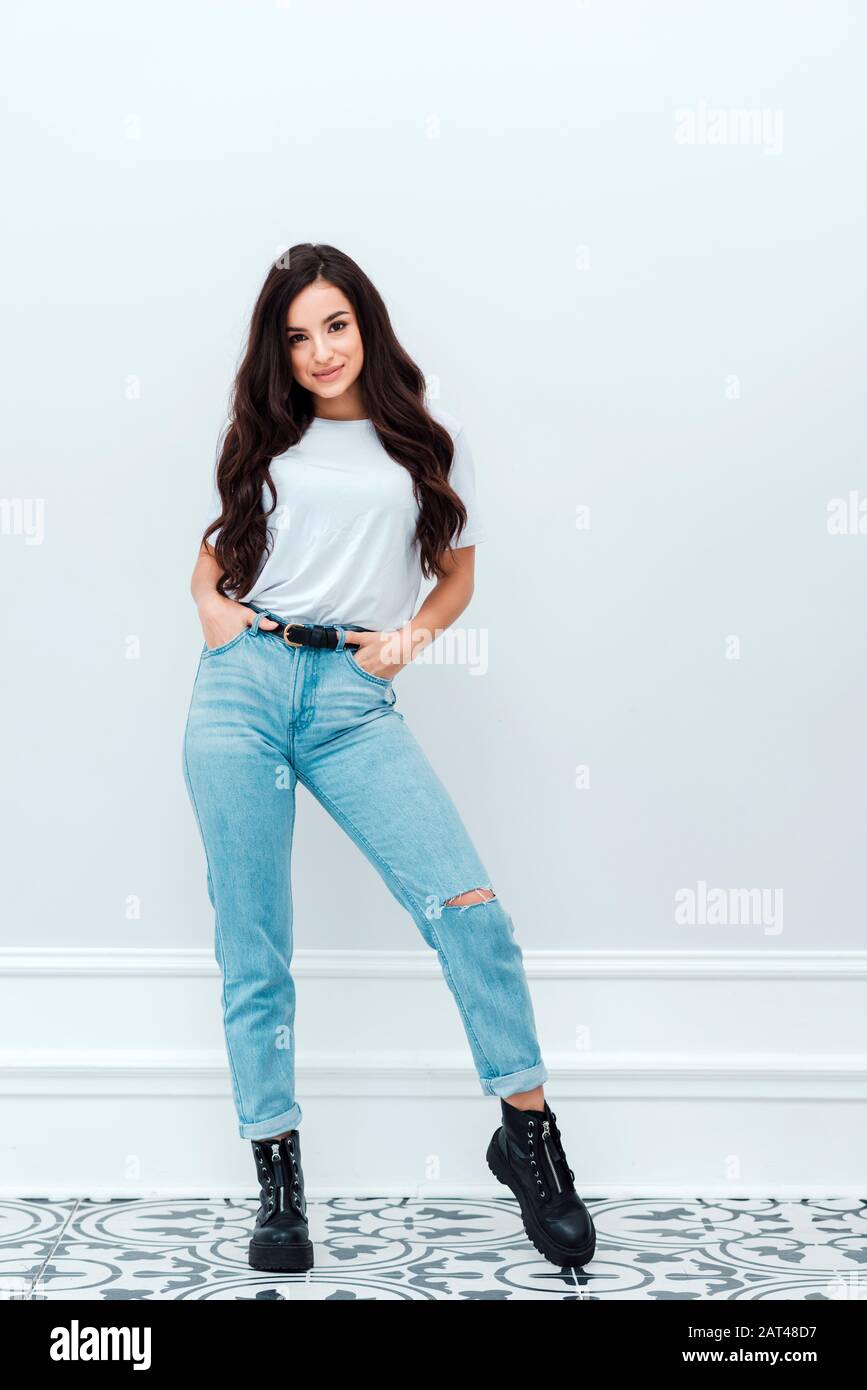 Pretty, slim girl posing on a white background. Copy space Stock Photo ...