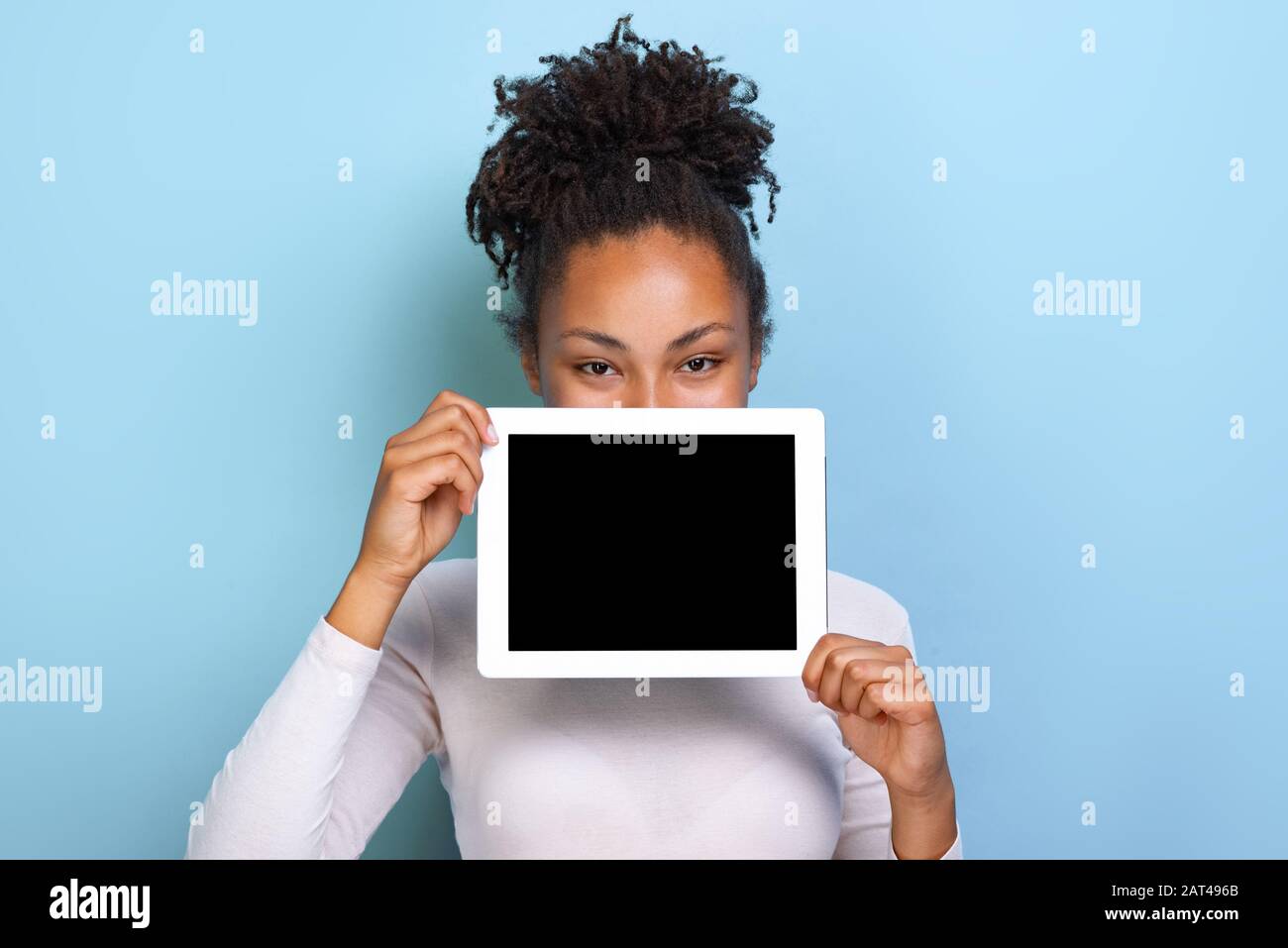 Mockup image of black empty blank screen of ipad in the female hand ...