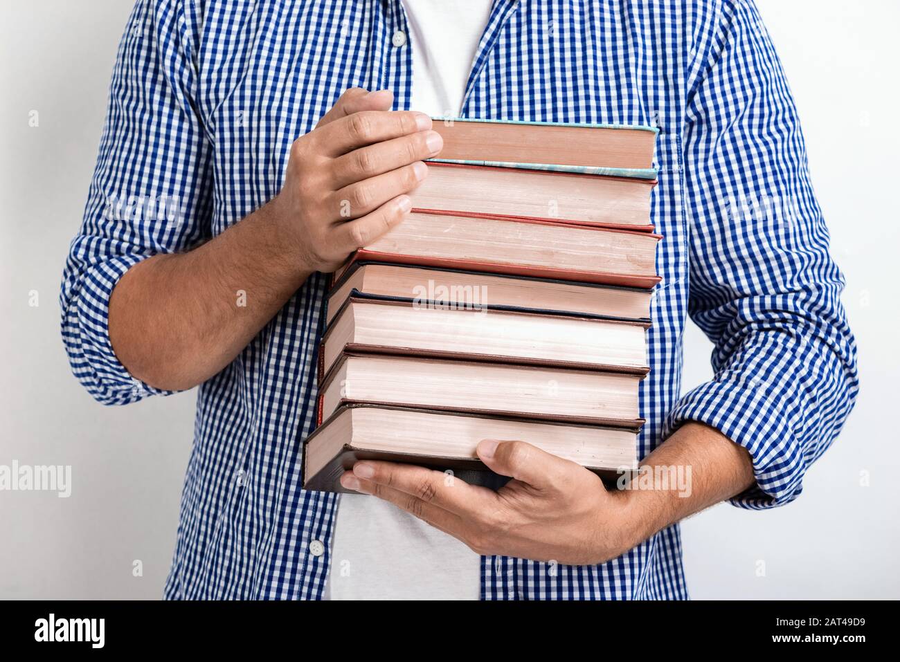 Closeup man holding books in his hands. Back to school.- Image Stock ...