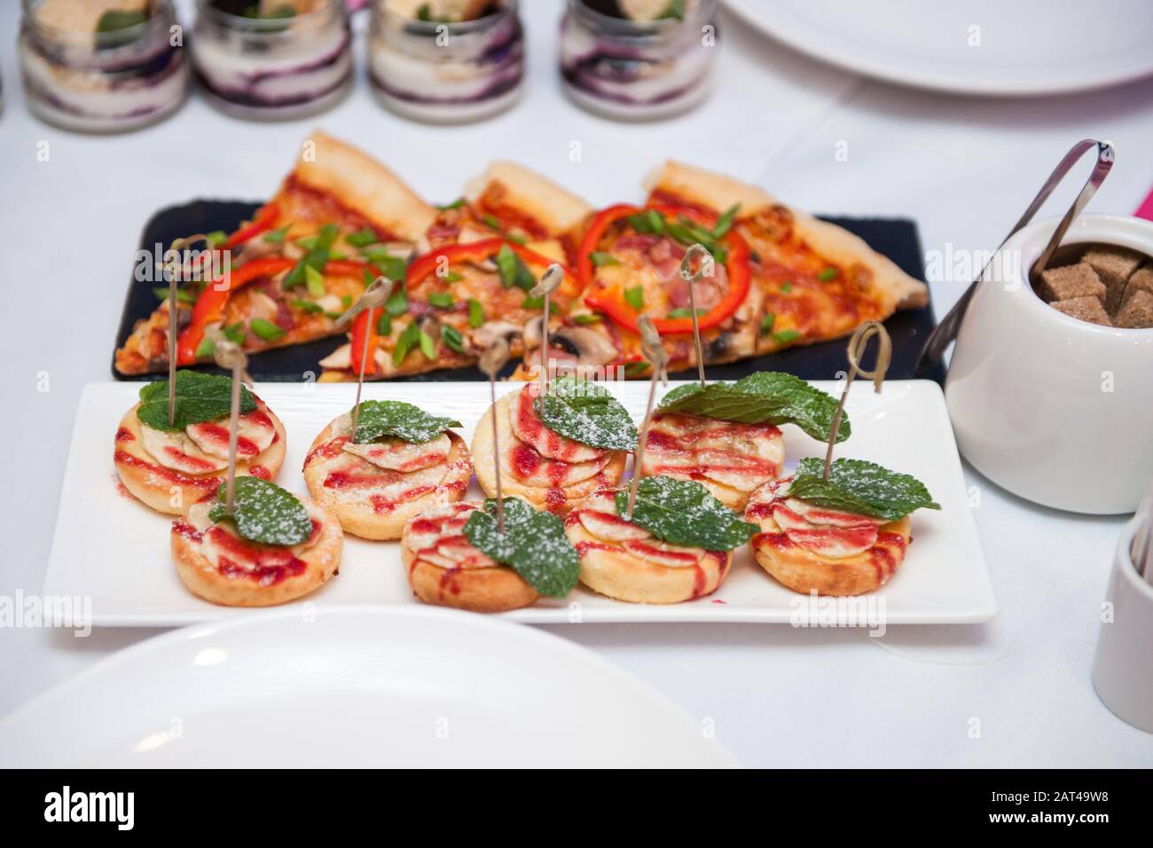 Catering food table set Stock Photo - Alamy