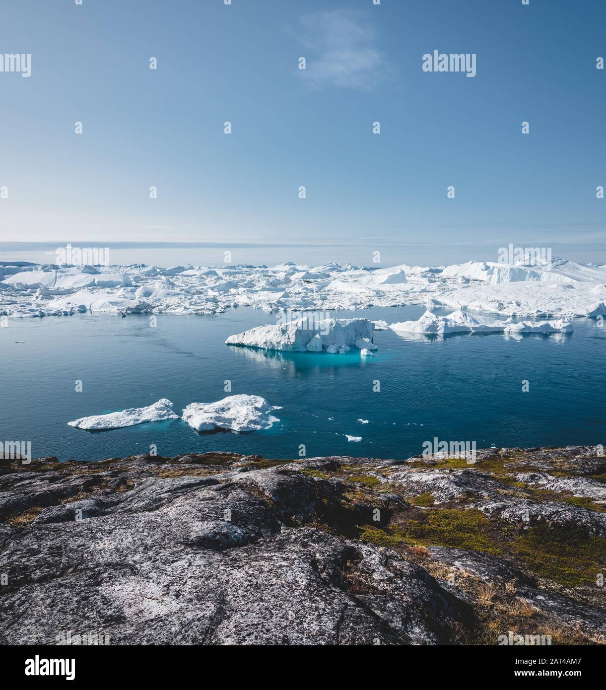 Iceberg and ice from glacier in arctic nature landscape in Ilulissat ...