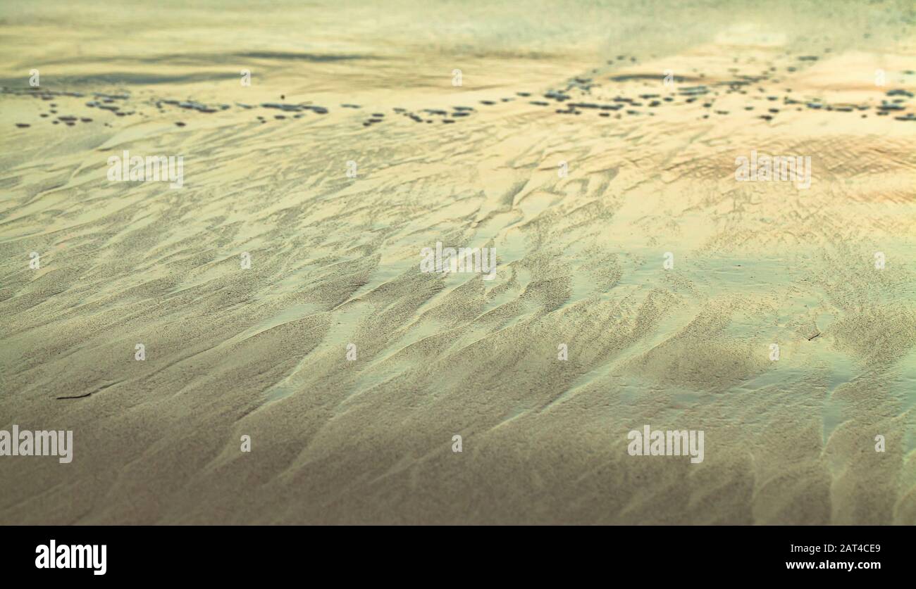 Sea water and shiny coastal sand, abstract vintage toned natural ...