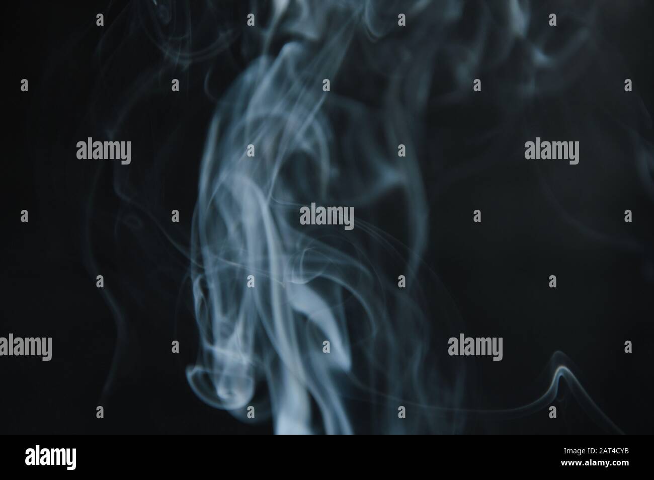 smoke floating without direction on black background Stock Photo - Alamy