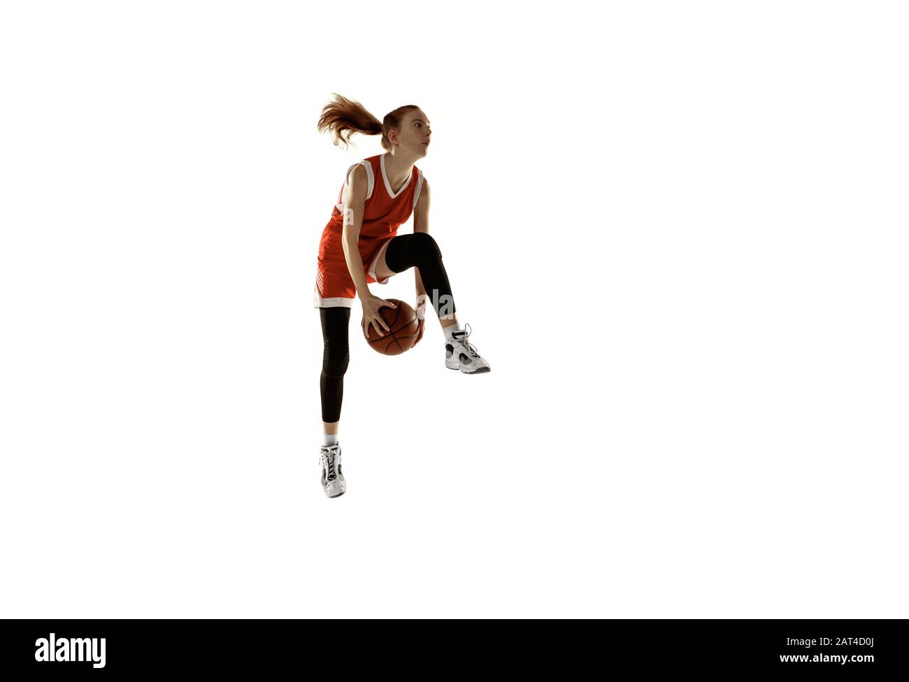 Young caucasian female basketball player in action, motion in jump ...