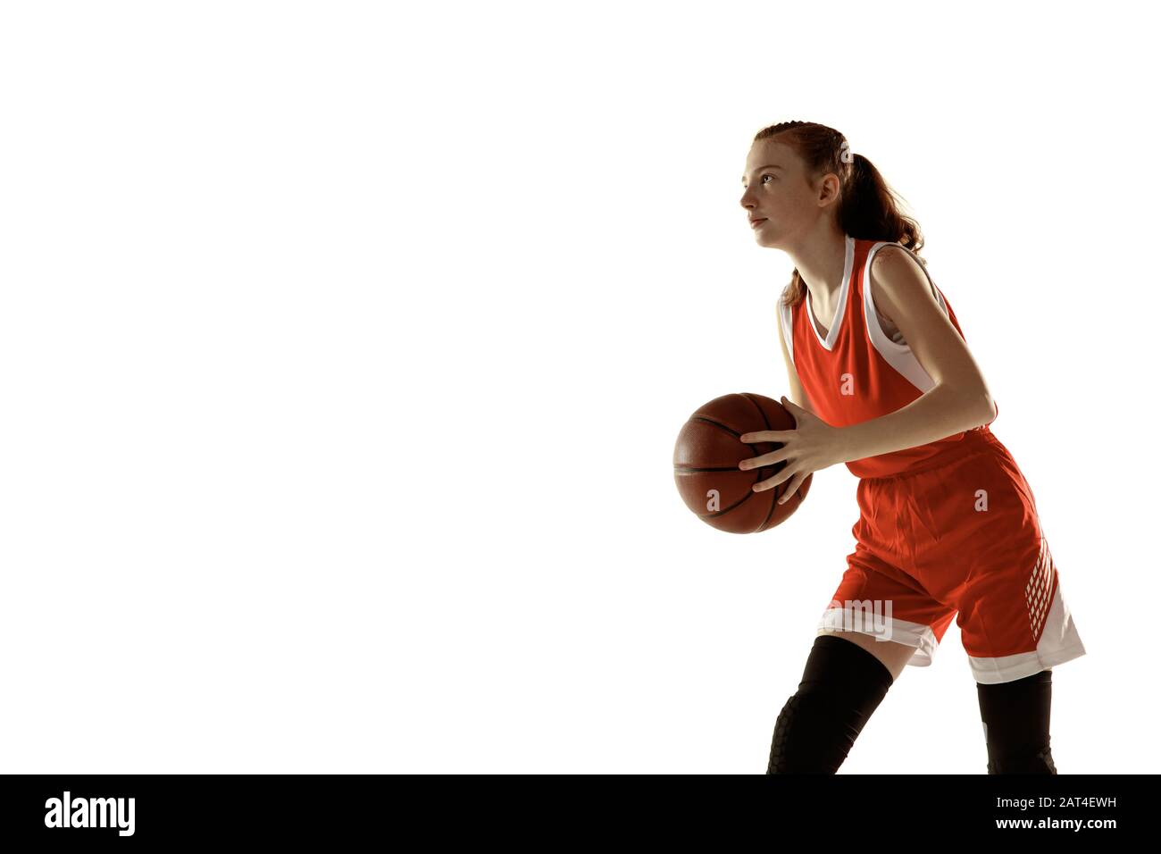 Young caucasian female basketball player in action, motion in run ...