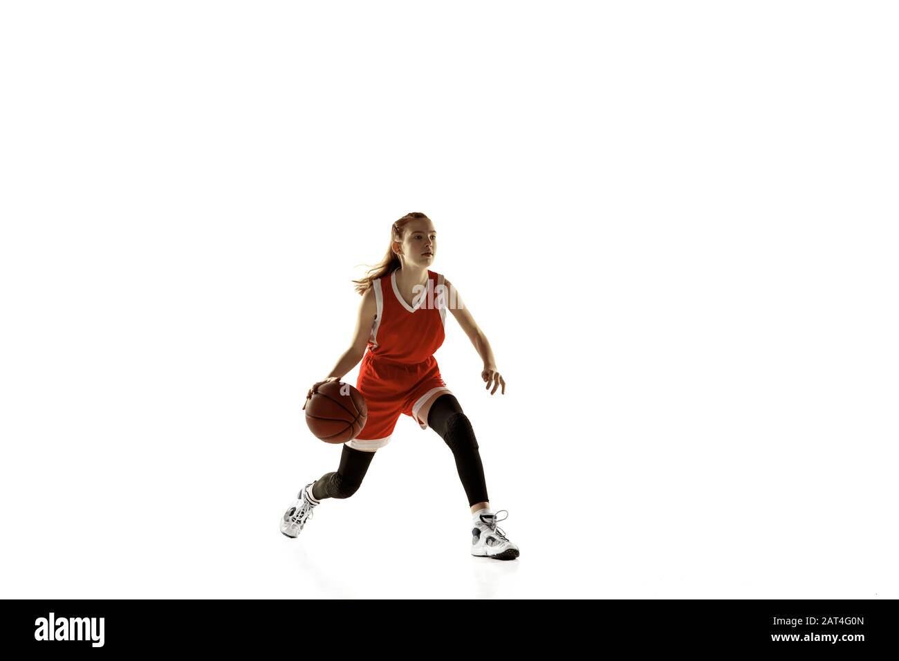 Young caucasian female basketball player in action, motion in run ...