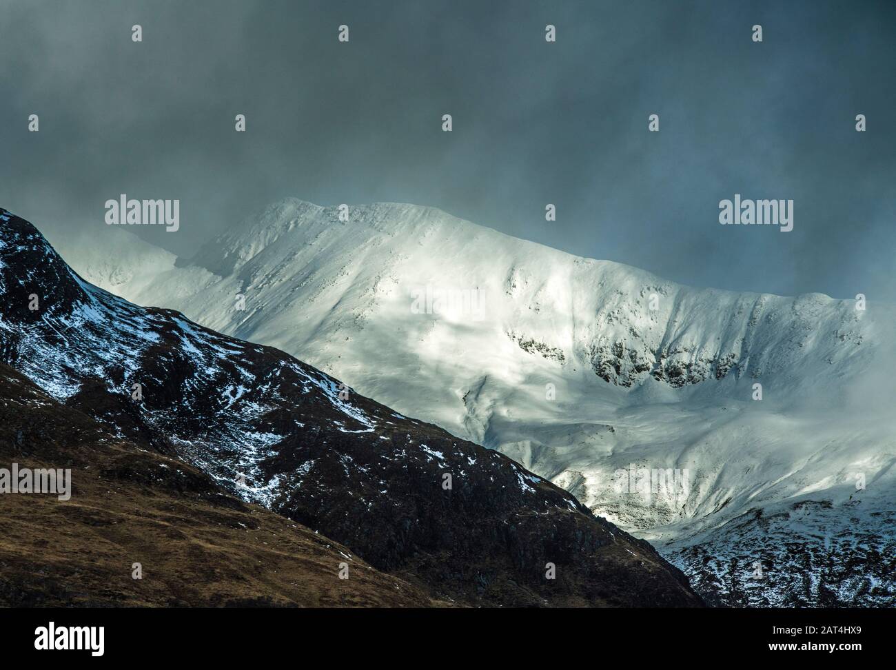 A heavily snow capped Binnean Mhor, a mountain high in the Mamores in ...