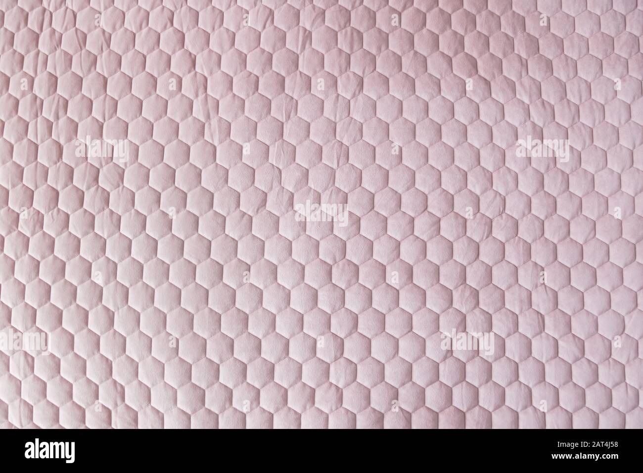 Pink color hexagon mesh fabric textured background Stock Photo - Alamy