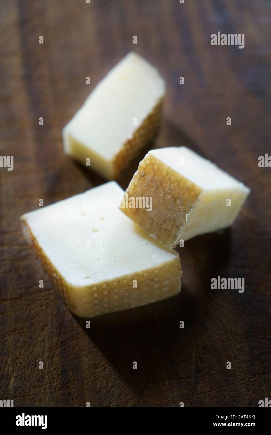 Sardinian goat cheese on a wooden board, Italy, Europe Stock Photo - Alamy