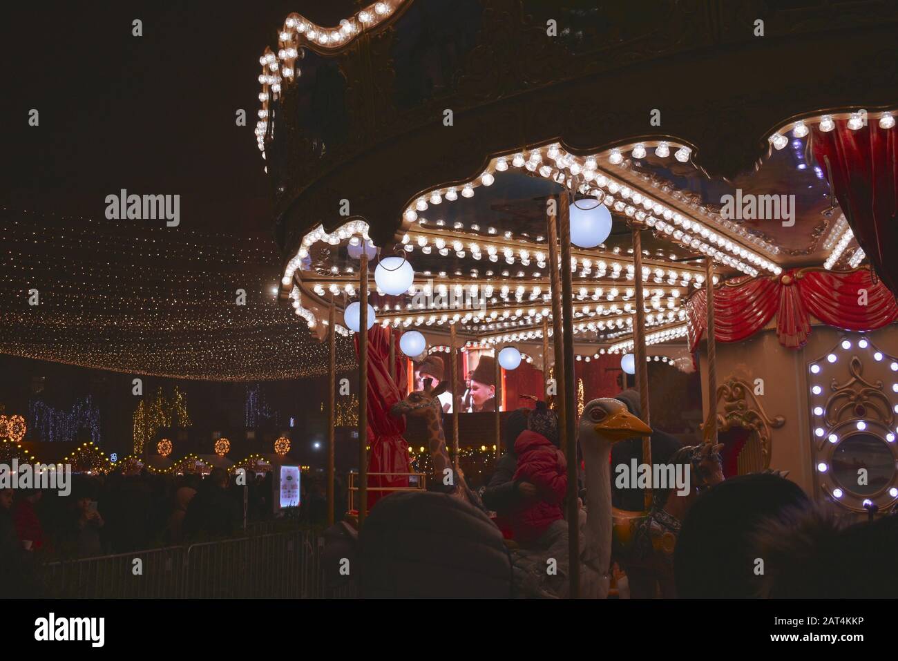 Christmas carousel with many white lights and a big duck Stock Photo ...