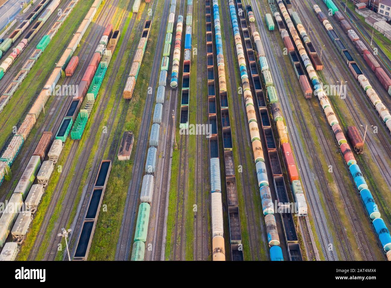 Aerial perspective view of railroad tracks, cargo sorting station. Many different railway cars ...