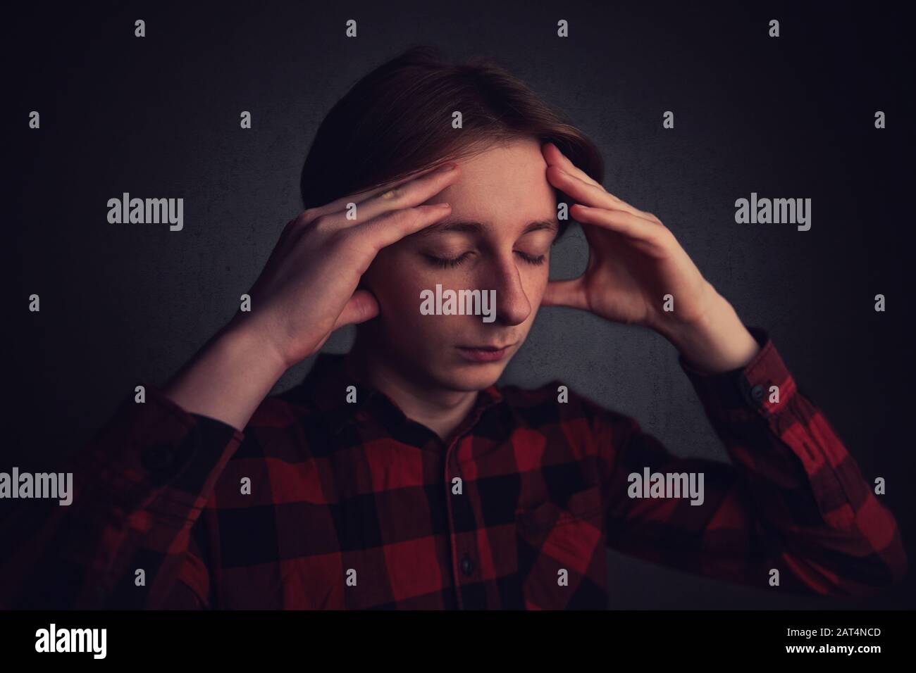Boy pointing hand forehead hi-res stock photography and images - Alamy