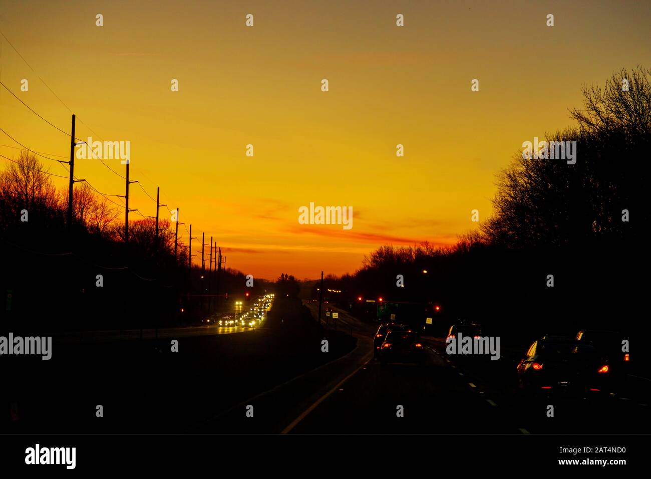 Cars stuck in traffic at dramatic sundown sunset time Stock Photo - Alamy