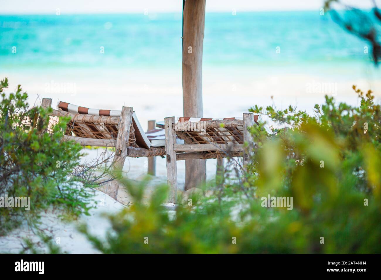 Beach lounge chairs on beautiful tropical luxury resort Stock Photo - Alamy