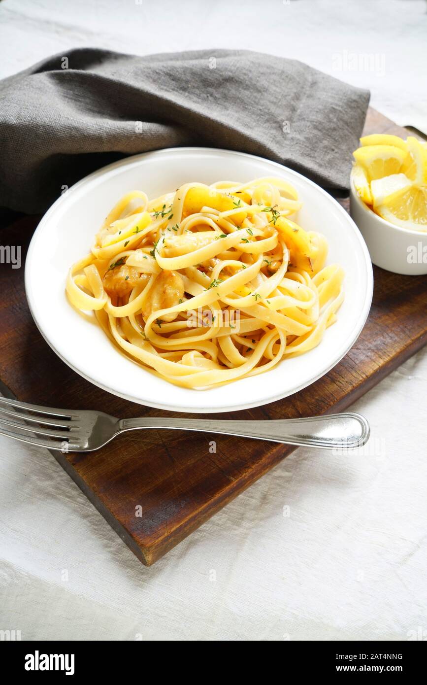 Traditional italian recipe, fettuccine pasta con limone e timo, topped ...