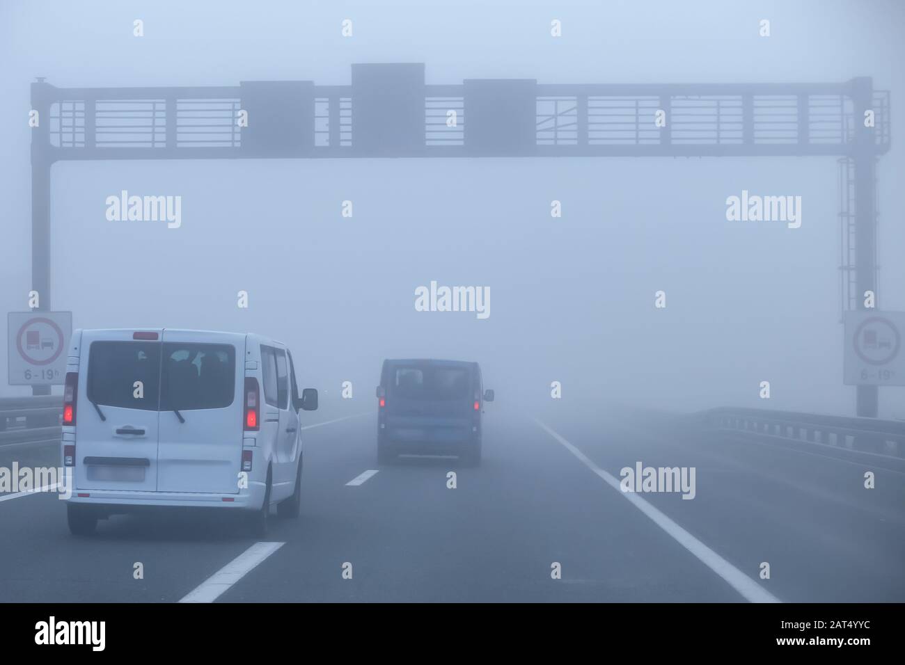 Traffic on the highway during thick morning fog Stock Photo - Alamy