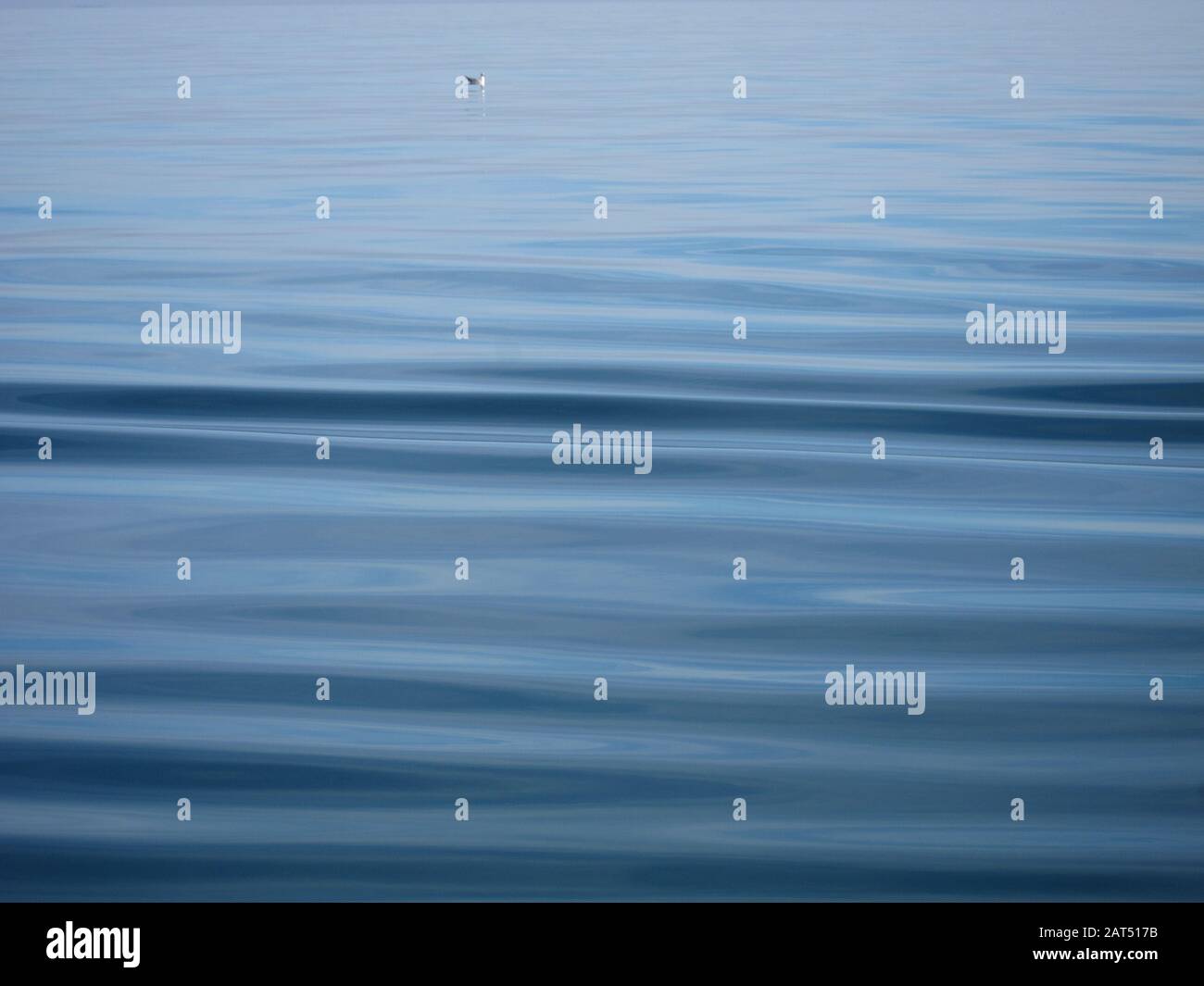 Sea in background with small ripples Stock Photo - Alamy