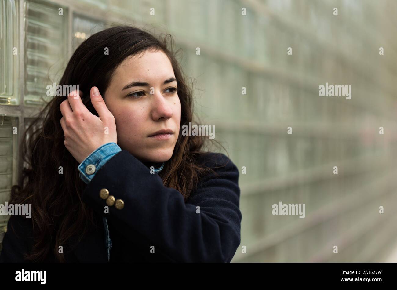 Woman looking glass wall hi-res stock photography and images - Alamy