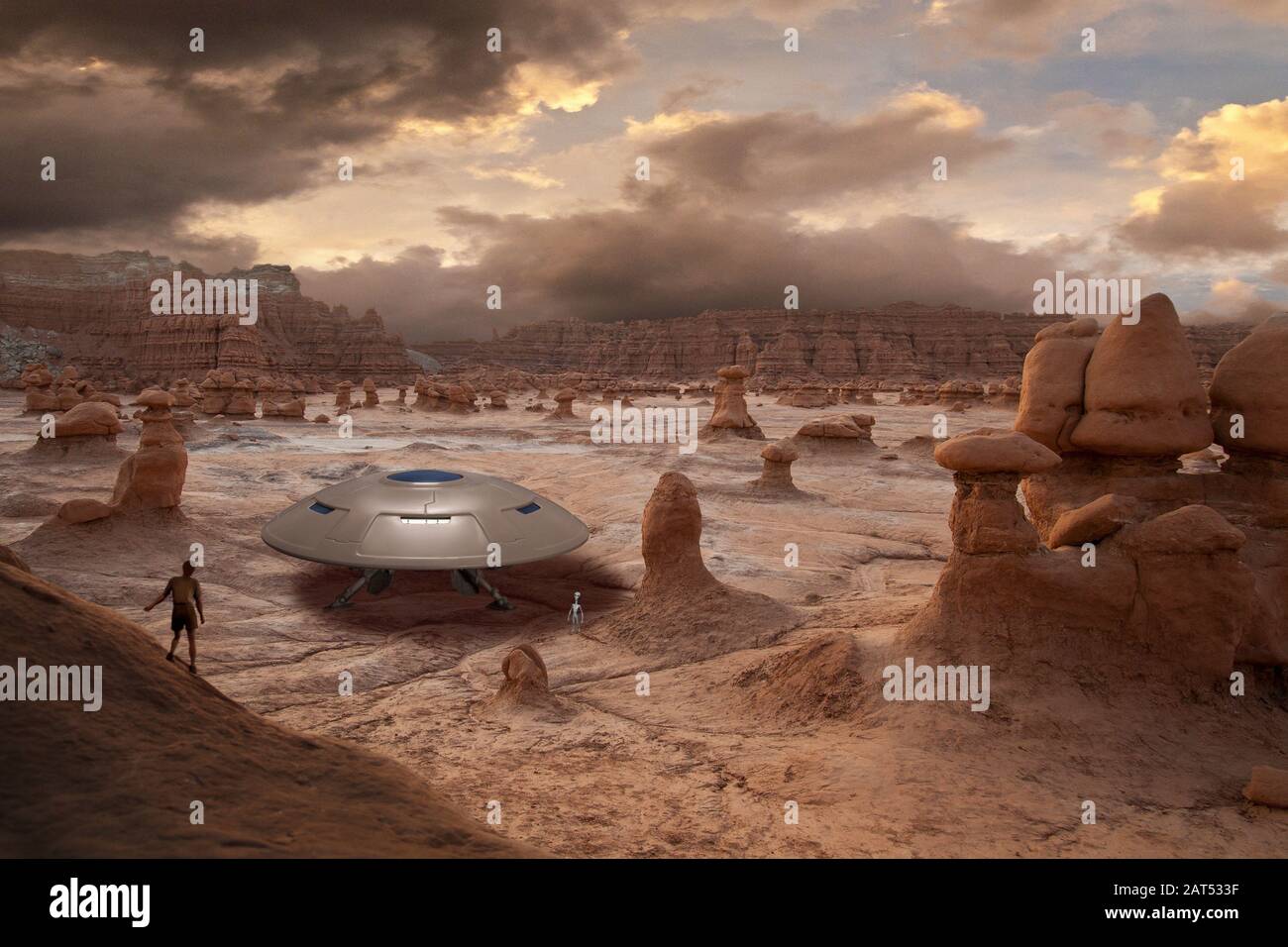 A hiker discovers a landed UFO in the desert with an alien Stock Photo ...