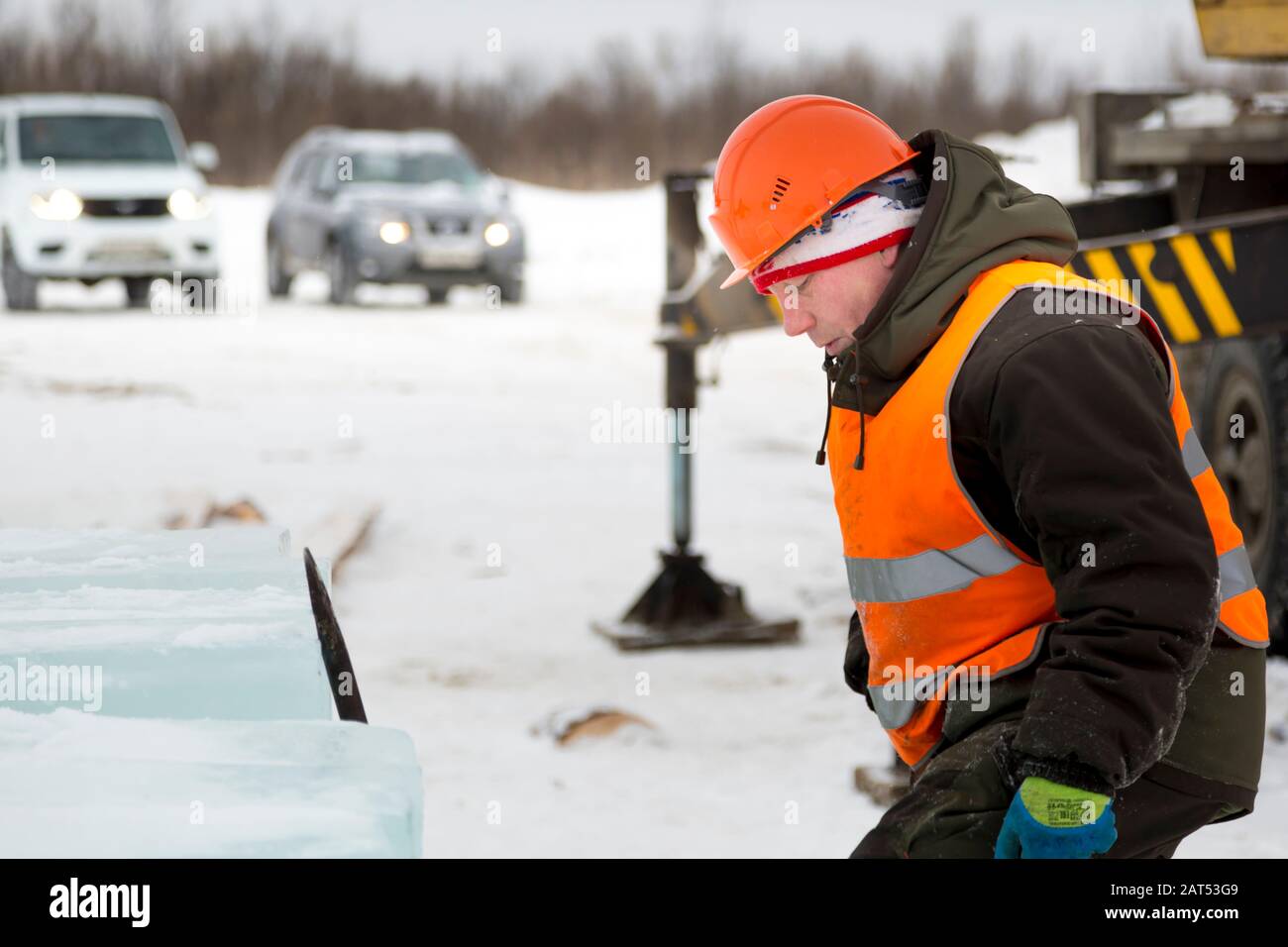 Worker in orange helmet hi-res stock photography and images - Alamy