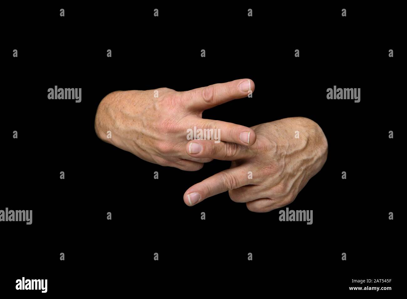 The word CARE in British sign language on an isolated black background ...