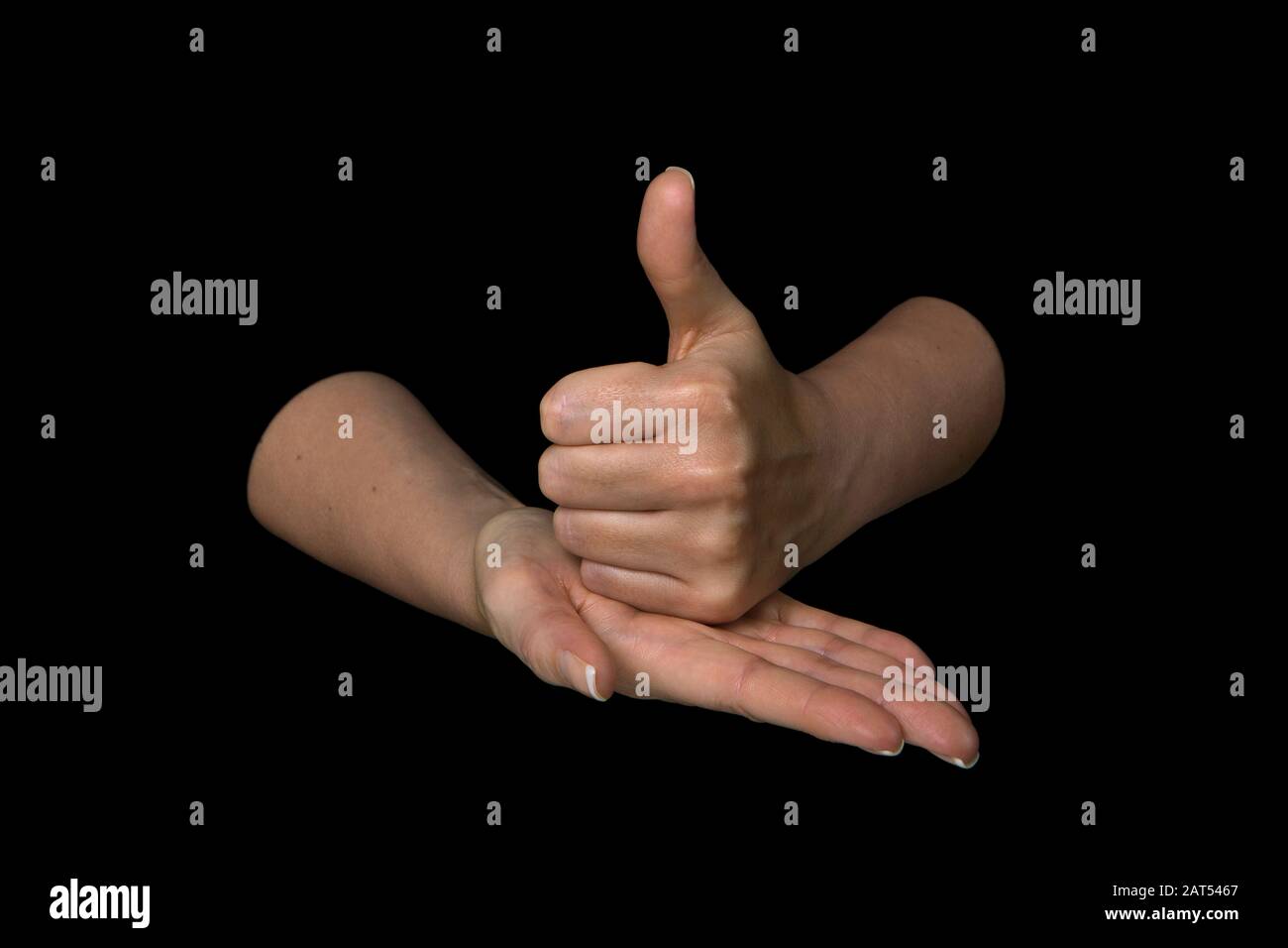 The word HELP in British sign language on an isolated black background ...