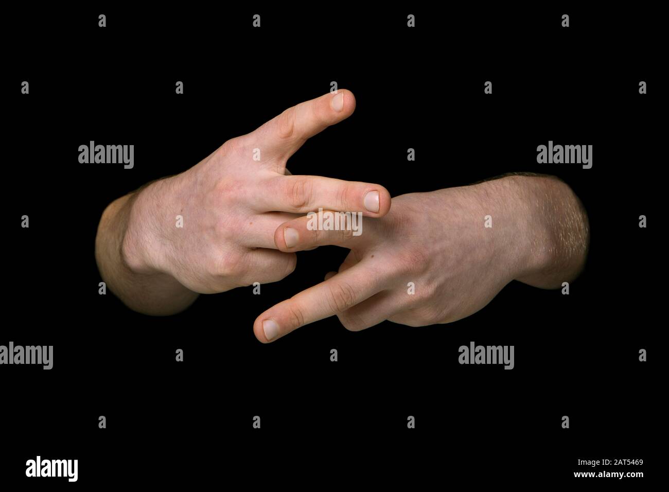 The word CARE in British sign language on an isolated black background ...