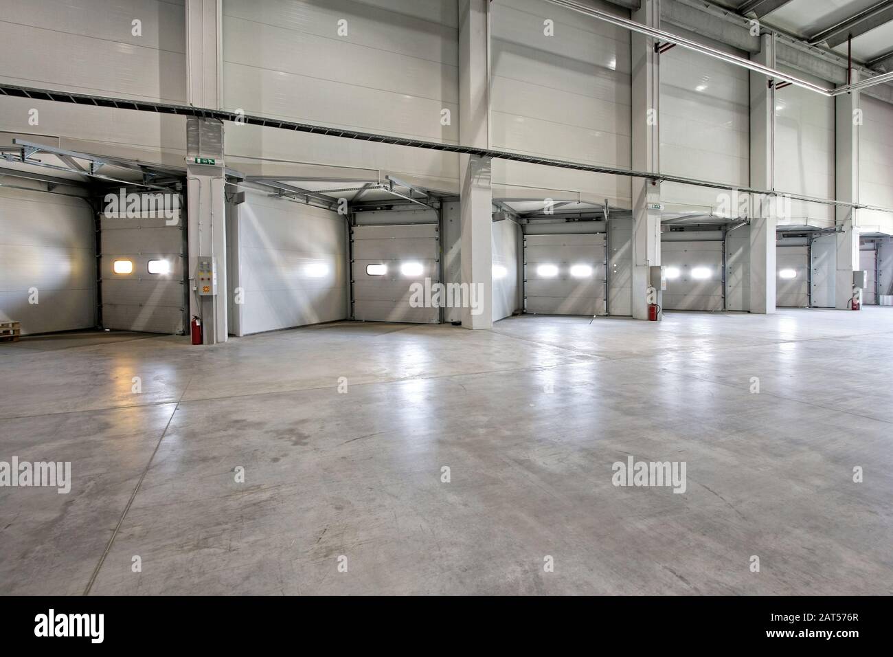 Loading warehouse deck with big cargo doors Stock Photo - Alamy