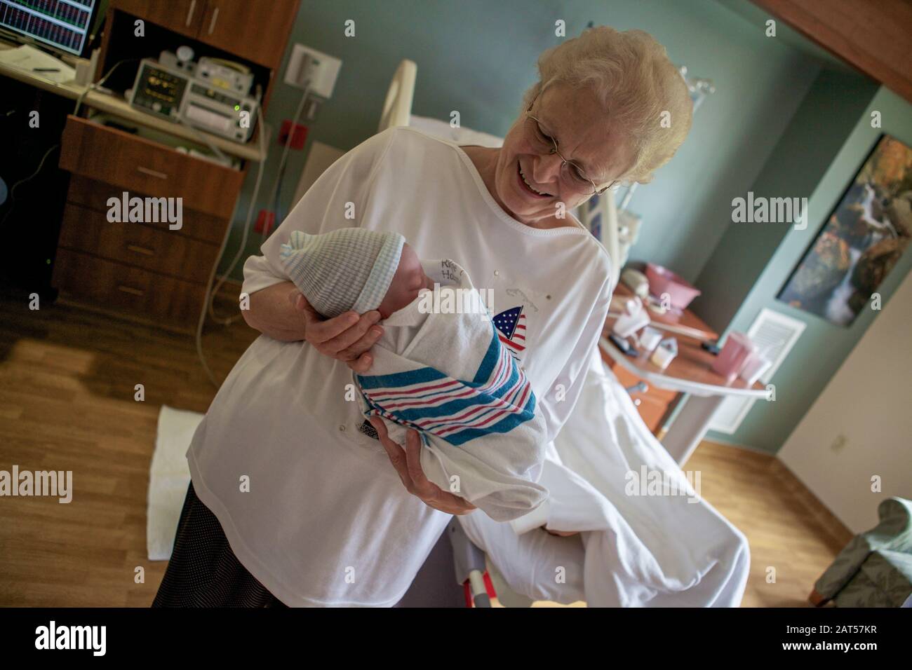 Happy grandmother looking to the new-born baby Stock Photo - Alamy