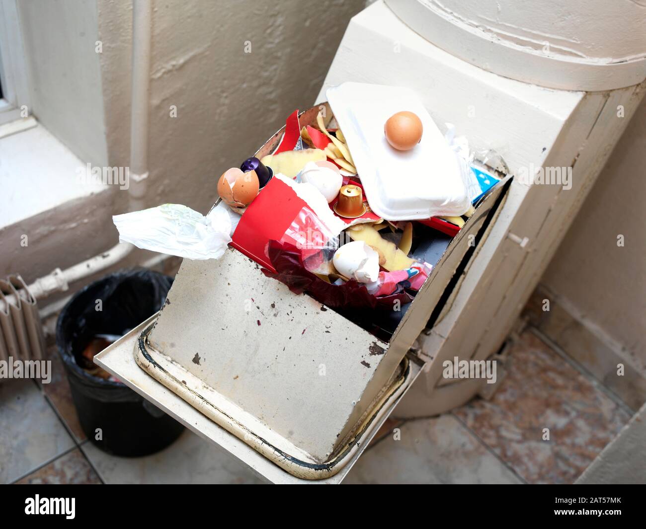 Chute clogged with household garbage, indoor close up shot Stock Photo ...