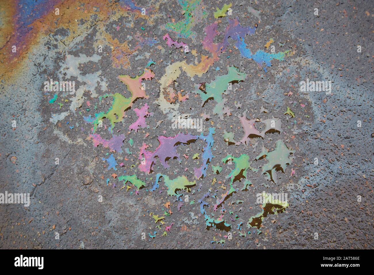 Colorful oil slick on pavement hi-res stock photography and images - Alamy