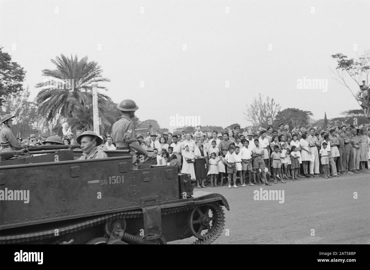 Parade at Bandoeng Universal carrier drives past public Date: July 1947 ...