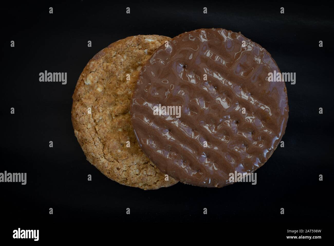 An eclipse of two chocolate oaty biscuits 2 Stock Photo - Alamy