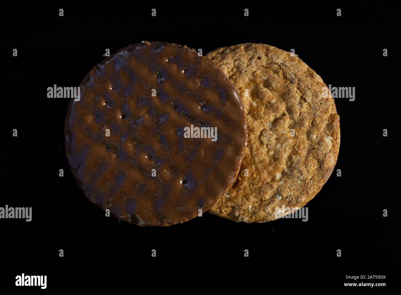 An eclipse of two chocolate oaty biscuits Stock Photo - Alamy