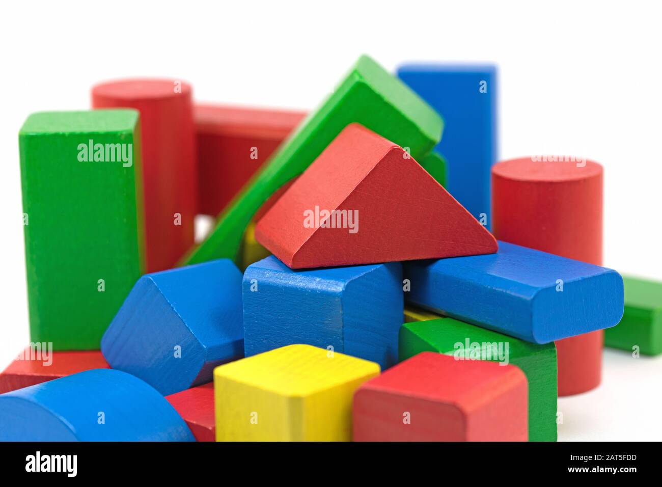 Colorful wooden building blocks against white background Stock Photo ...