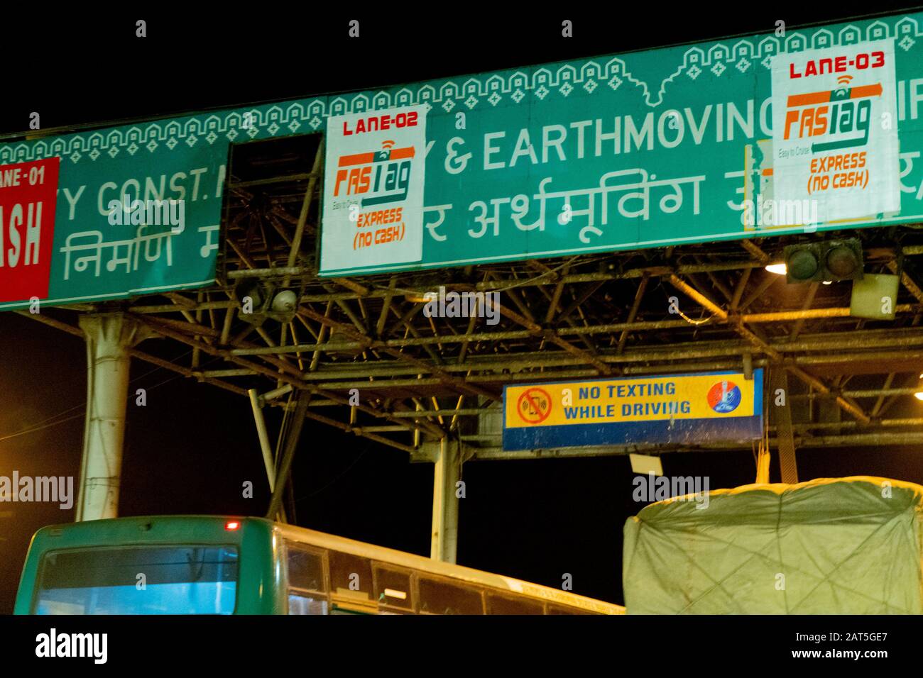 Green head board of NHAI toll booth with sticker for Fastag and cash ...