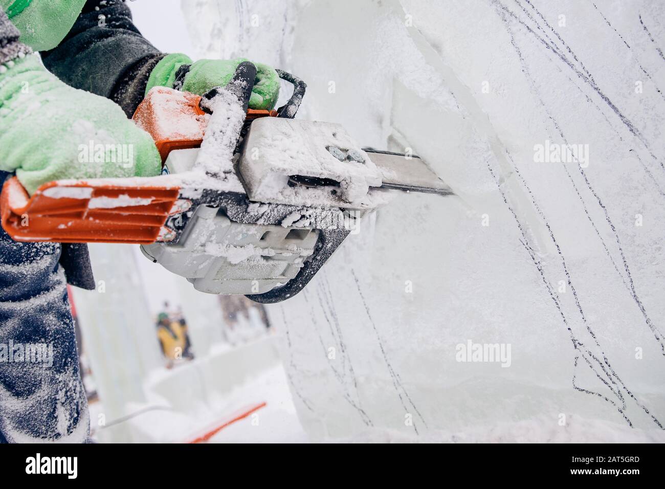 Ice sculpture carving man use chainsaw cut frozen winter Stock Photo ...