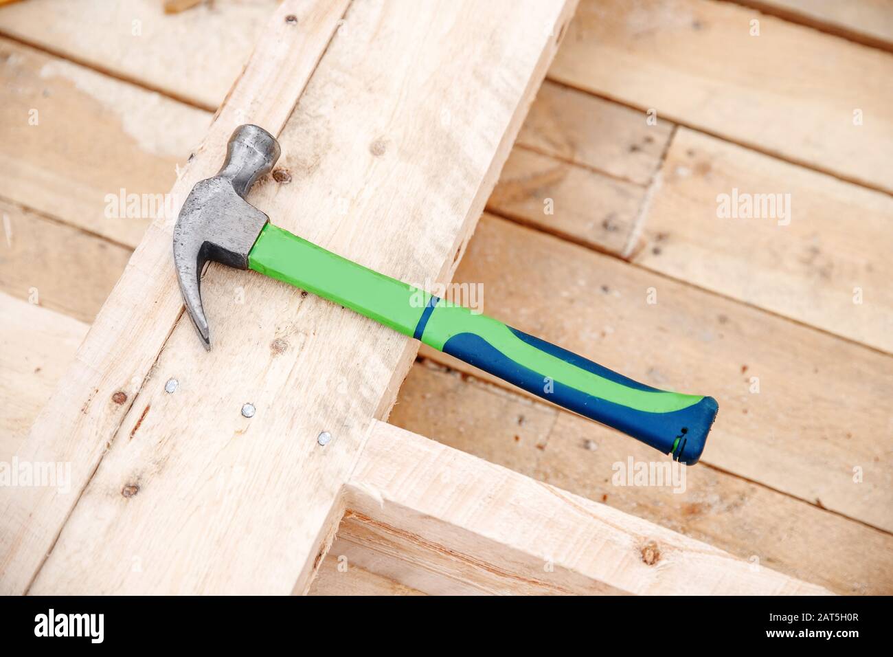 Background hammer tool for building wooden planks Stock Photo - Alamy