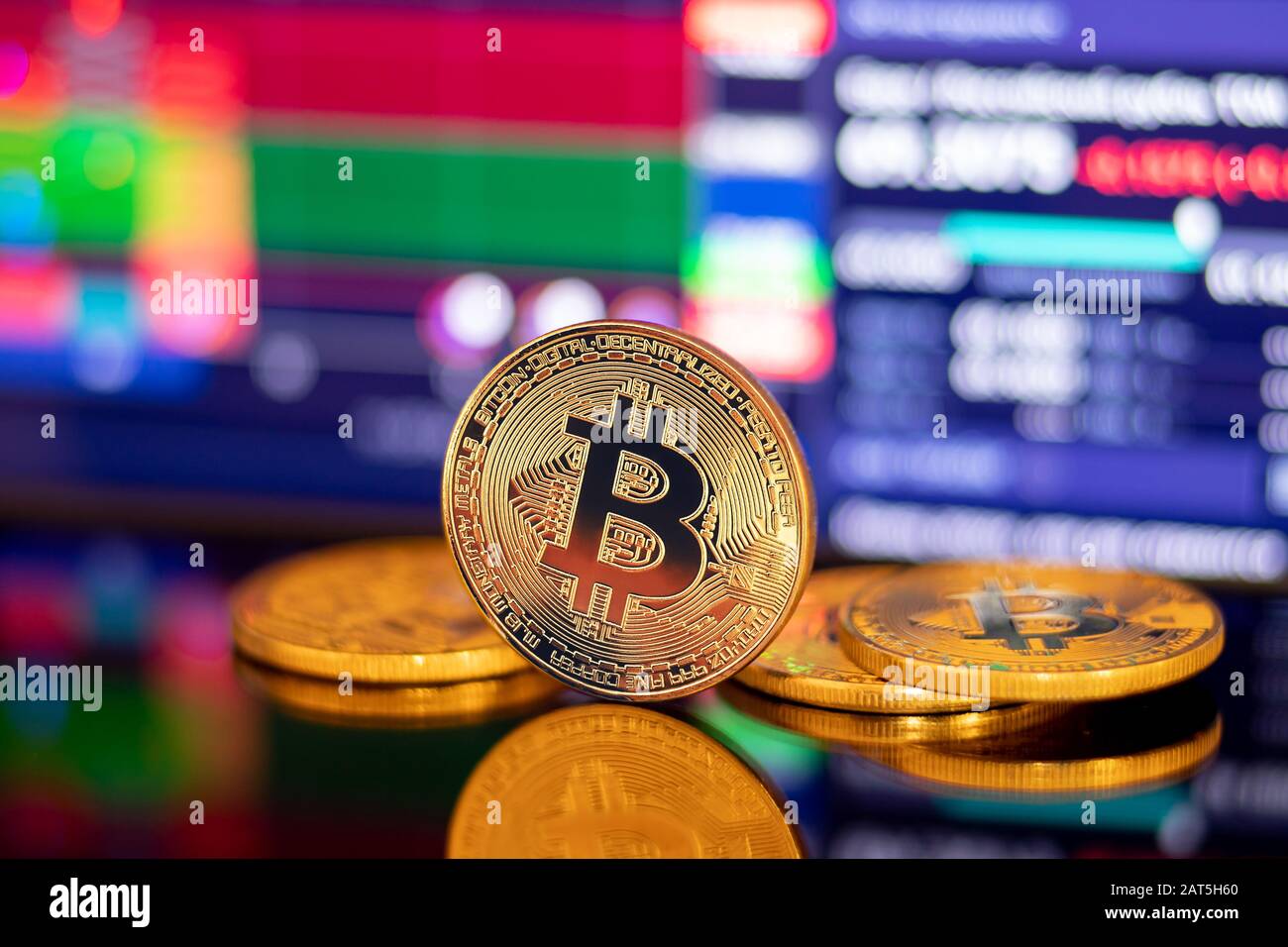 Gold Bitcoin crypto currency on background of dawn chart diagram ...