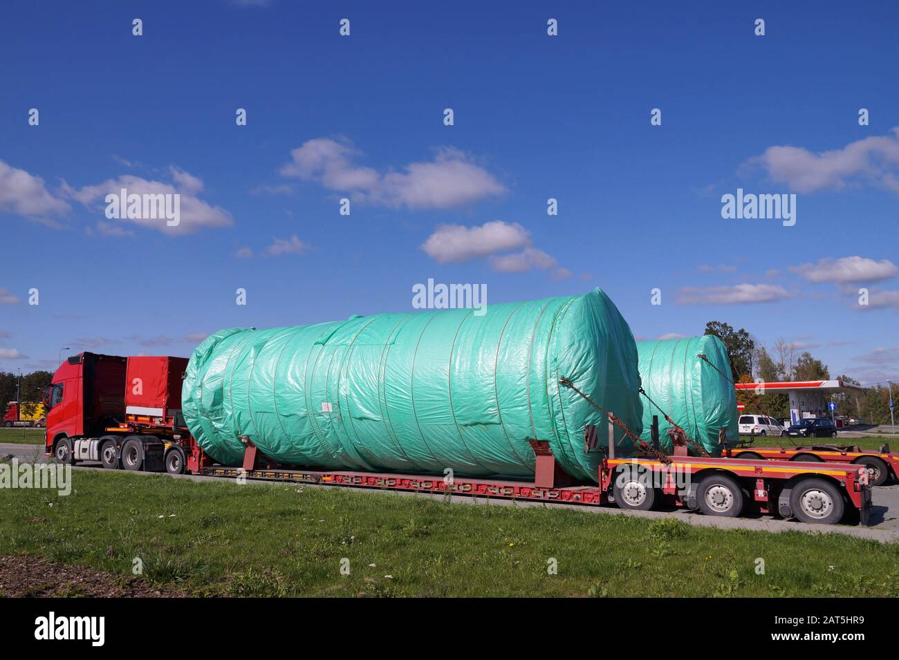 A two truck with a special semi-trailers for transporting oversized ...