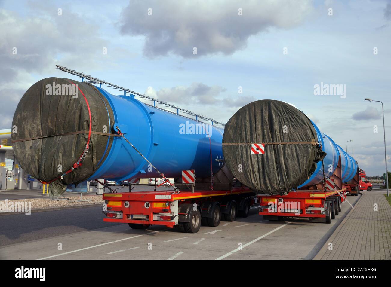 A two truck with a special semi-trailers for transporting oversized loads. Oversize Load or ...