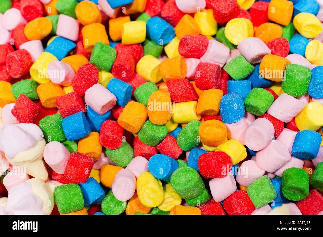 mass of multi-colored marmalade sweets. Powdered sweets texture Stock ...