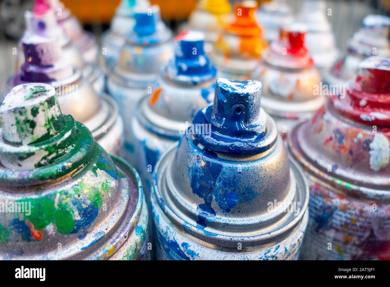 bunch of messy paint spray cans with colorful used paint markings Stock ...