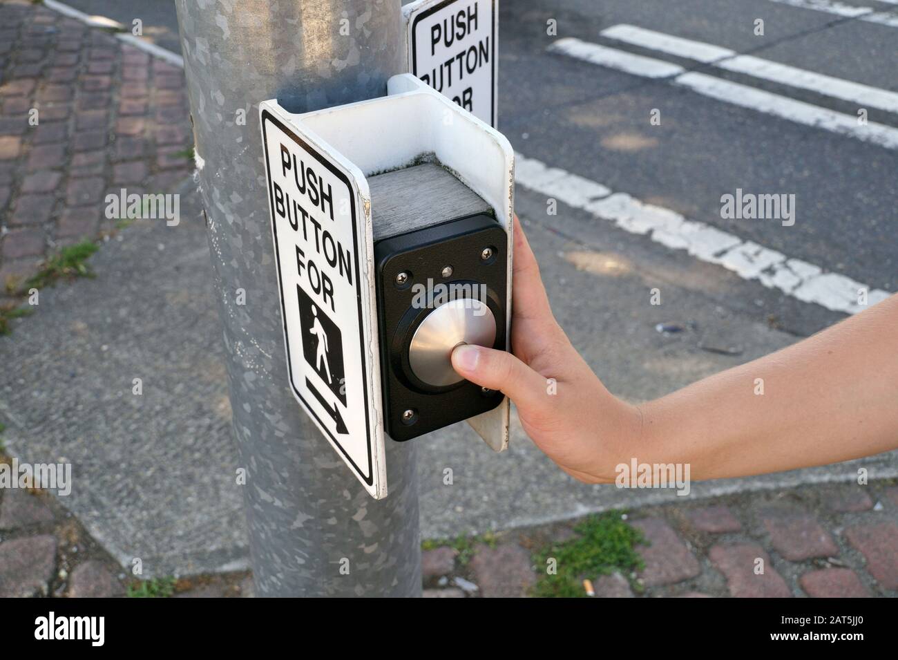 Pedestrian presses button in hi-res stock photography and images - Alamy