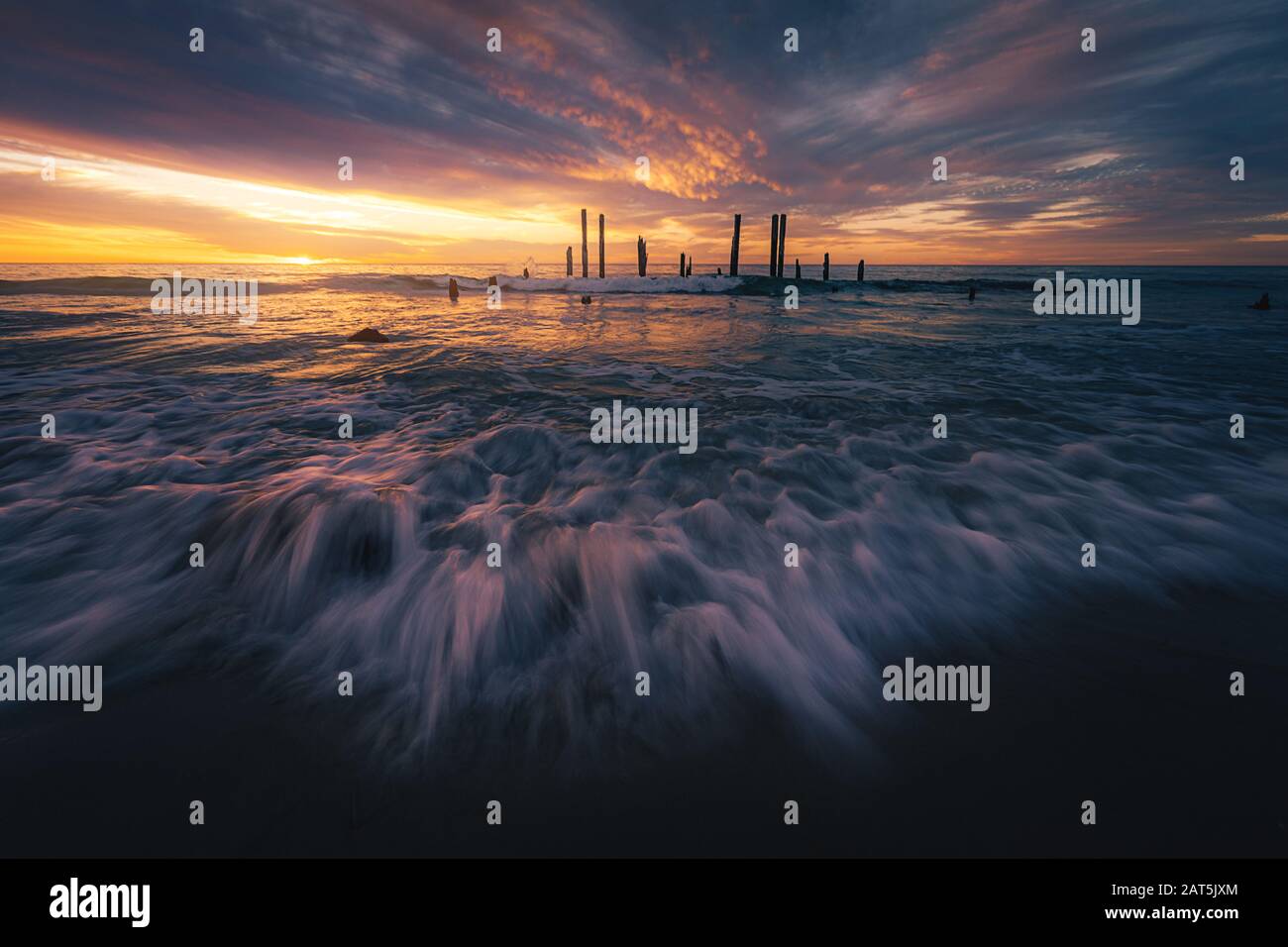 Sunset over the old jetty, Port Willunga, South Australia Stock Photo ...