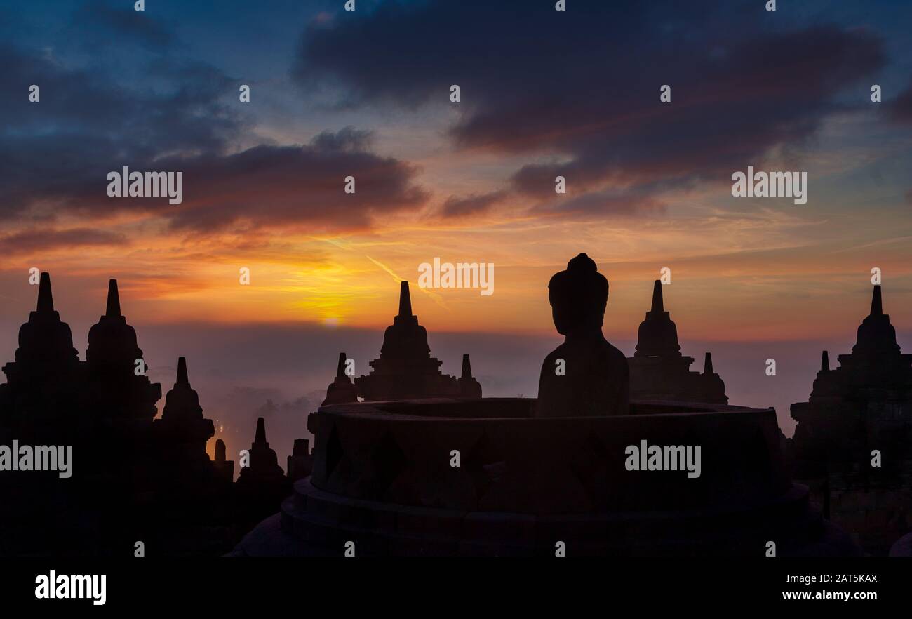 Buddha statue at sunrise, Borobudur temple complex, Borobudur ...