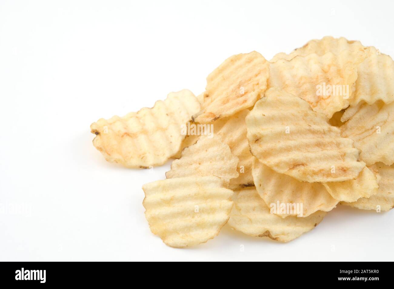 Potato chips isolated on white Stock Photo - Alamy